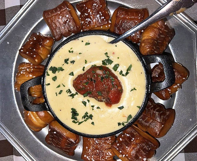 These pretzel bites surrounding molten gouda dip create the kind of appetizer standoff where everyone's thinking, "I'll let others have the last one," while plotting to grab it.