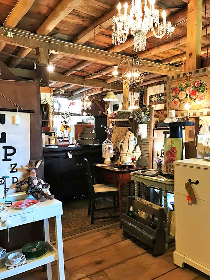 Those chandeliers hanging from barn beams prove that elegance and rustic charm can absolutely be roommates who get along.