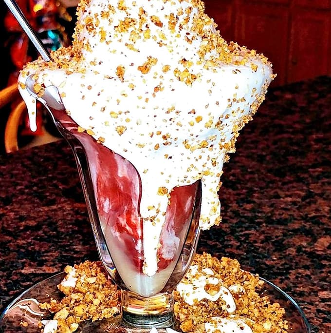 The red velvet bubble takes decadence to new heights, layering rich cake with that signature soft serve and crunchy peanut topping.