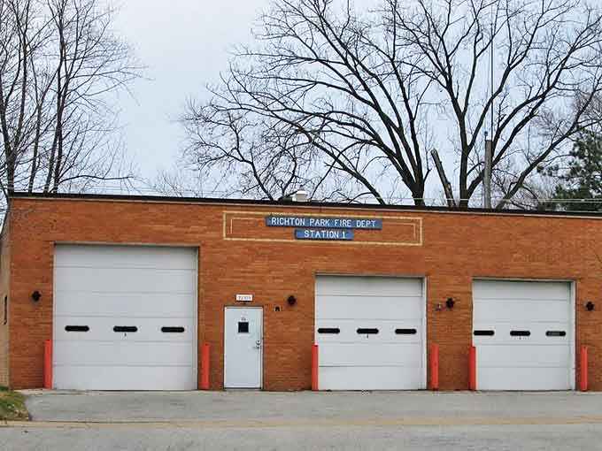 The brick façade of Richton Park Fire Department Station 1 stands ready but rarely needed, a reassuring presence in this peaceful community.