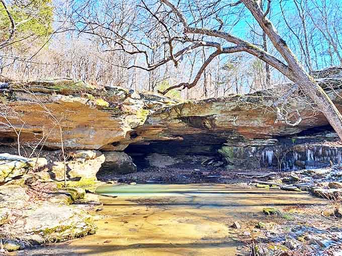 A natural stone archway frames this serene pool, creating nature's perfect infinity edge that would make any resort architect jealous.