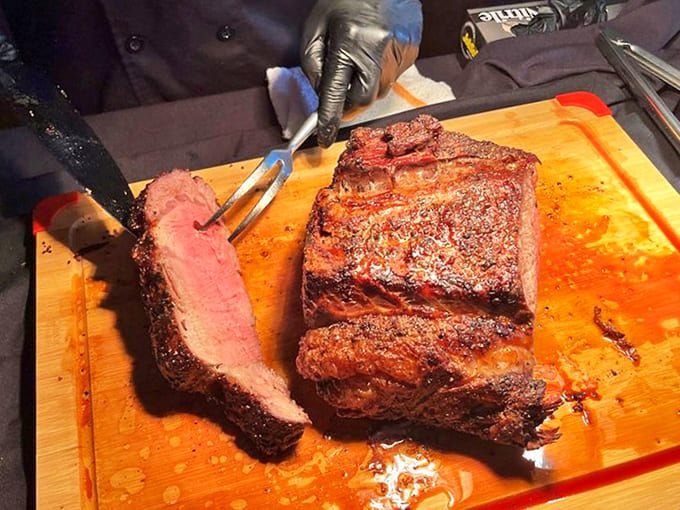 A culinary masterpiece in the making &ndash; the prime rib being carved reveals meat aged and seasoned to perfection.