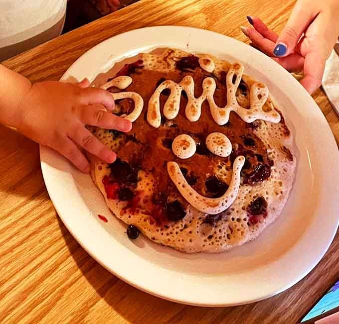 Who says you can't play with your food? This smiley pancake proves breakfast is the most joyful meal of the day.