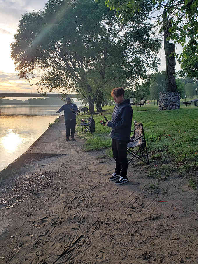 Sunset transforms the riverbank into nature's prime fishing spot, where patience meets possibility under the golden evening light.