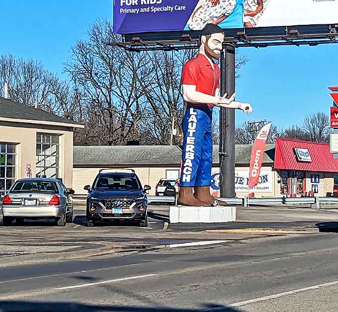 Even the auto shop seems miniature beside him. The Muffler Man transforms an ordinary parking lot into a must-stop photo opportunity.