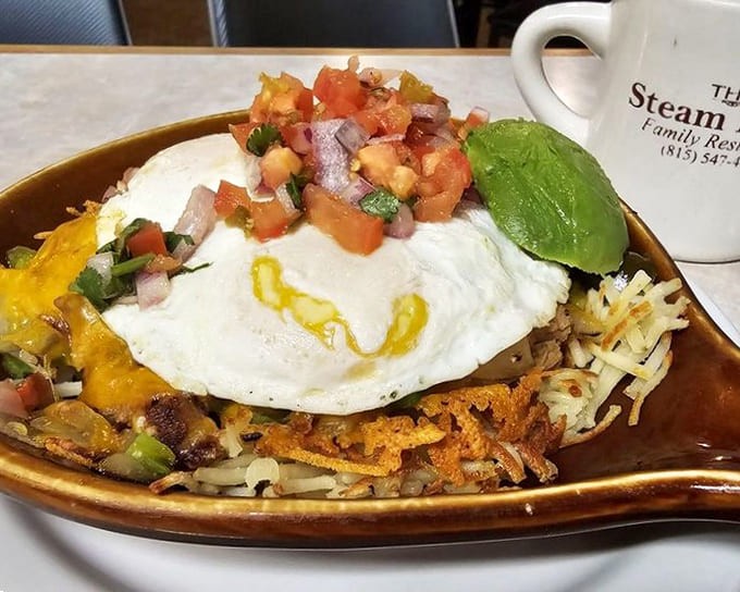 Chicken Carnita Skillet loaded with peppers, onions, cheese, and perfectly cooked eggs proves that sometimes the best meals come in cast iron vessels that still sizzle.