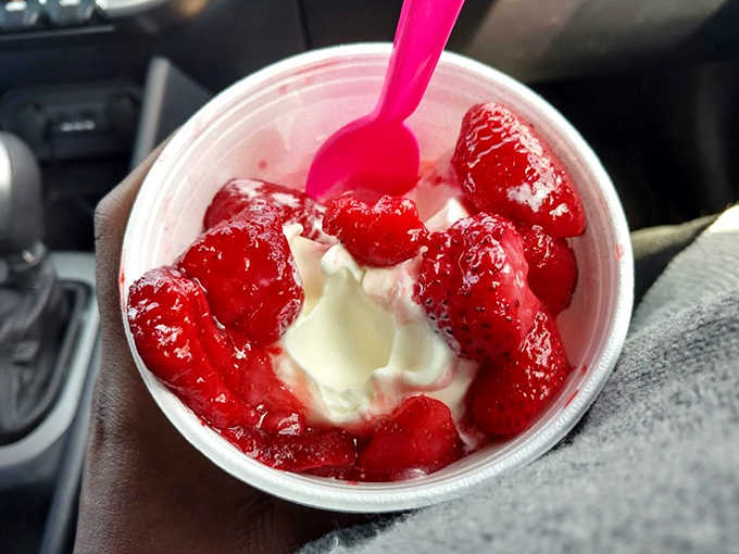 Fresh strawberries nestled in creamy custard create a symphony of textures and flavors that makes spoons move at record speed.