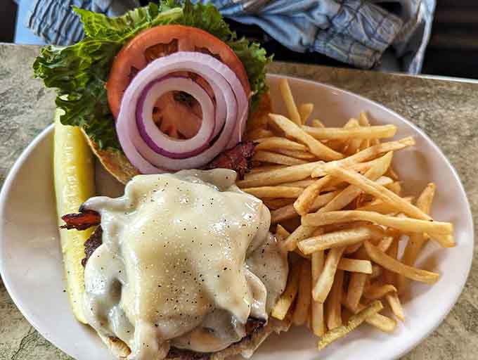 A perfectly grilled burger with crispy fries proves The Old Mohawk does the classics right every single time.