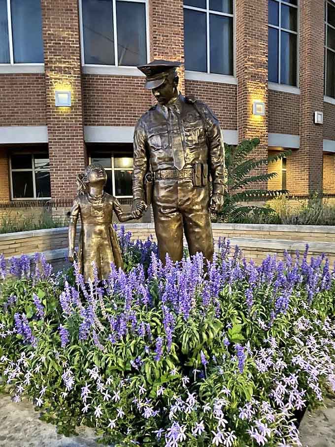 This bronze officer and child walking hand-in-hand through a garden of lavender speaks volumes about community connection in small-town America.