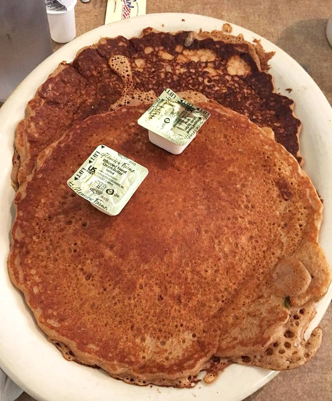 These aren't just pancakes &ndash; they're golden discs of joy that make you question why anyone would eat anything else before noon.