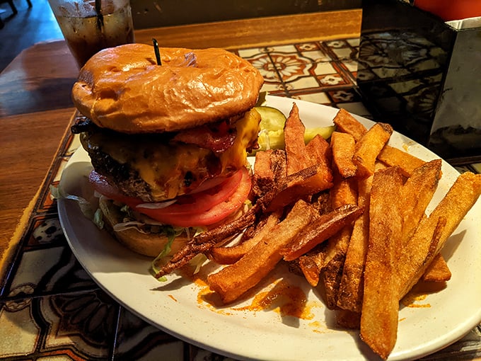 Another angle of burger perfection&mdash;notice how the cheese cascades down the sides like a dairy waterfall. Poetry on a plate.