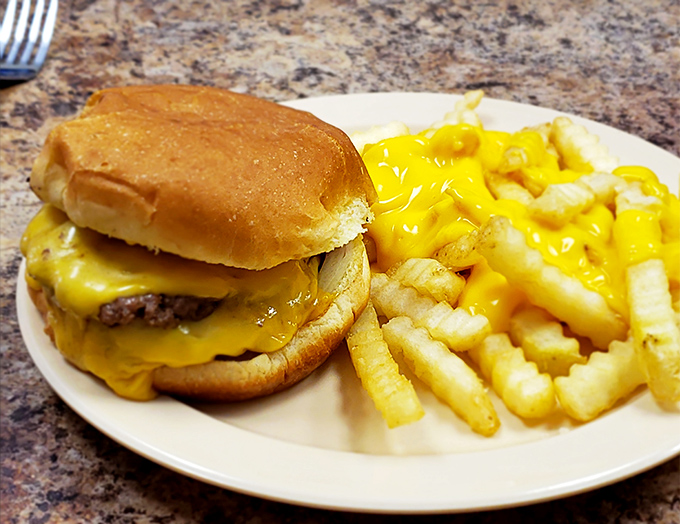 The Triple Cheeseburger with cheese fries – when you're hungry enough to eat a horse but civilized enough to want it properly cooked.