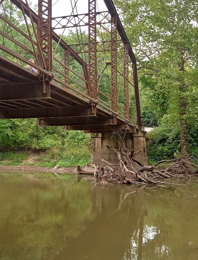 The bridge's underside reveals intricate engineering from a bygone era, when craftsmanship met practical necessity.