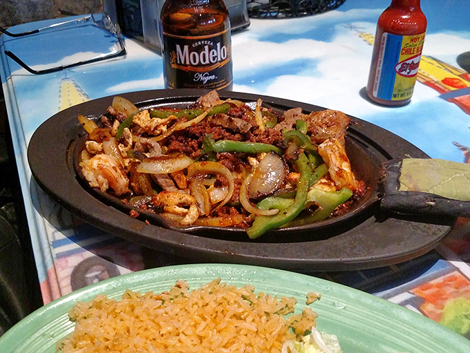 Sizzling fajitas arrive like culinary performance art – the sound, the steam, the smell creating a moment of anticipation before the first delicious bite.
