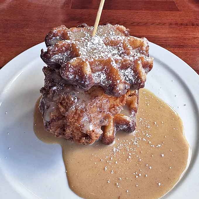 Breakfast alchemy at its finest &ndash; golden waffle meets savory gravy in a combination that makes you question everything you thought you knew about morning meals.