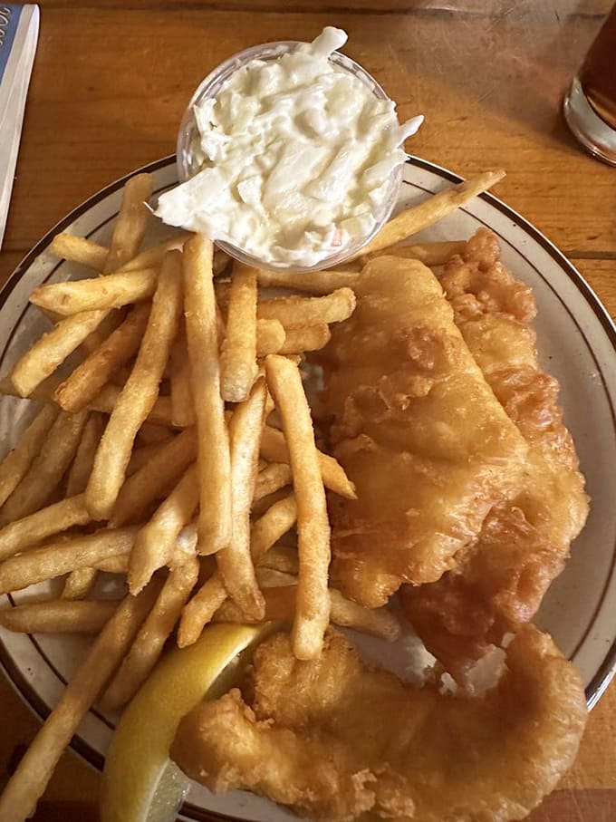 Golden-battered walleye and crispy fries prove that sometimes the simplest pleasures are the most satisfying culinary treasures.