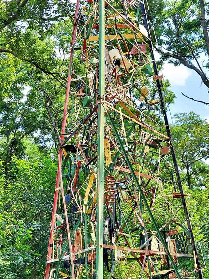 This intricate metal obelisk reaches skyward like it's trying to high-five the clouds, one welded piece at a time.
