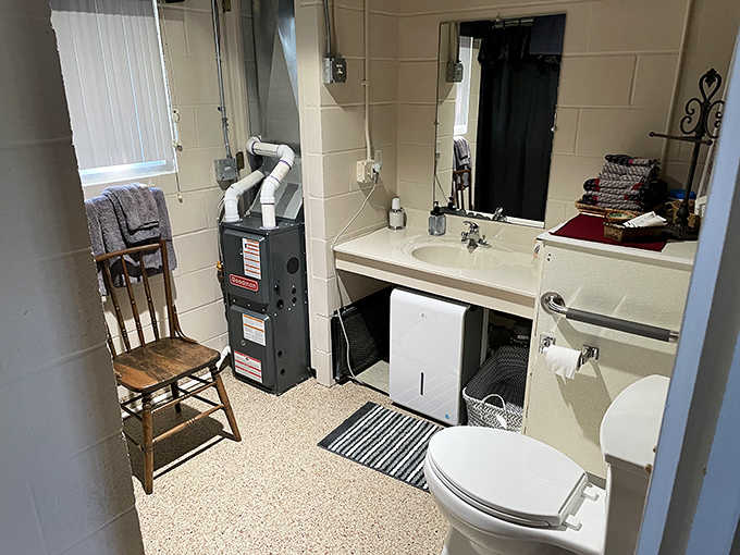 No prison-style facilities here! The bathroom has been thoroughly modernized while maintaining touches of vintage charm throughout the space.