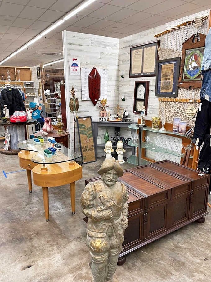 A cozy nook featuring a handmade braided rug and yellow shelving creates the perfect backdrop for browsing everything from glassware to figurines.