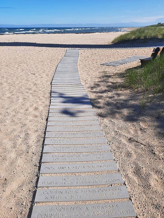 This commemorative walkway honors supporters and visitors, turning a simple path to the beach into a meaningful journey where every step tells someone's story.