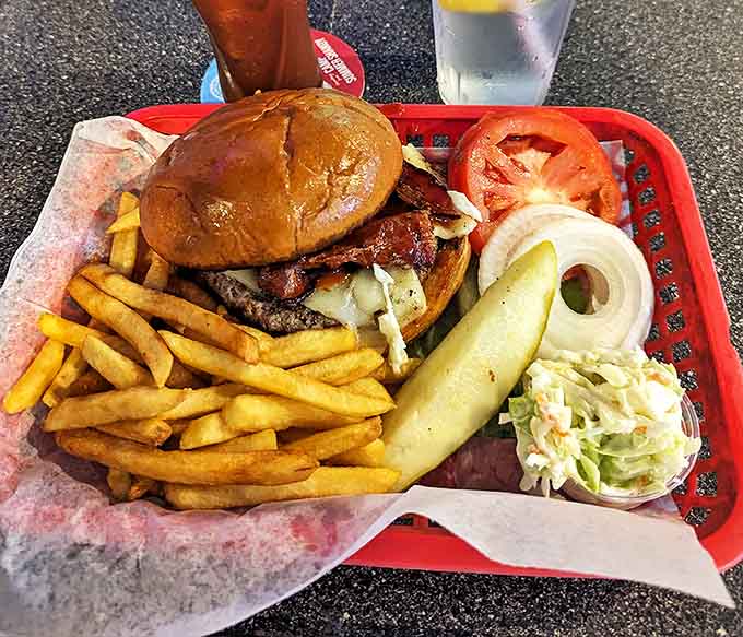 The burger arrives like a champion on pit row &ndash; juicy patty, melty cheese, crisp bacon, and all the fixings ready for their victory lap around your taste buds.