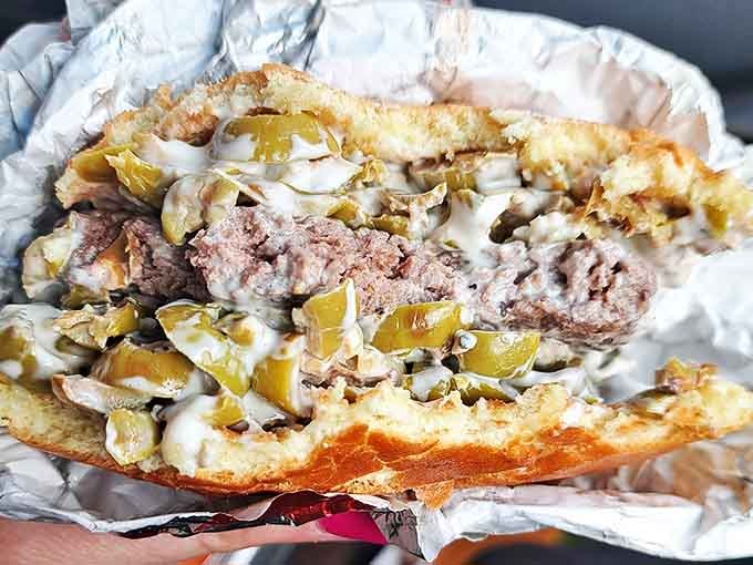 Behold the burger in all its glory &ndash; a hand-formed patty topped with melty cheese and grilled onions that might just make you forget about hot dogs altogether.