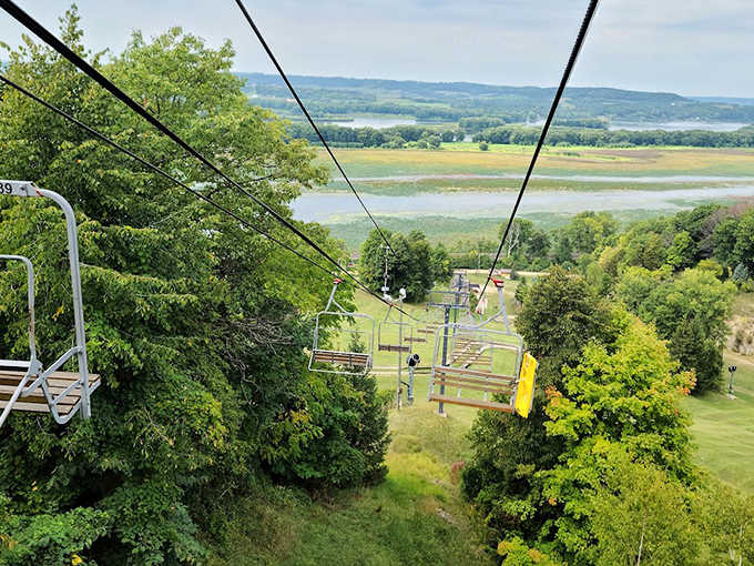 Chairlift conversations and anticipation build as riders ascend the hillside, trading city stress for mountain-top perspectives.