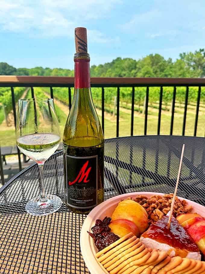 A bottle of Chardonnay Reserve stands sentinel over a gourmet charcuterie board – wine country's perfect power couple.