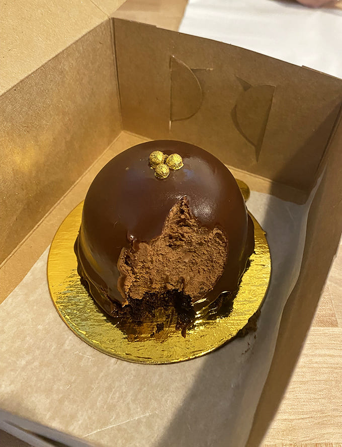 This chocolate mousse bomb is what happens when pastry chefs decide subtlety is overrated and go straight for glory.