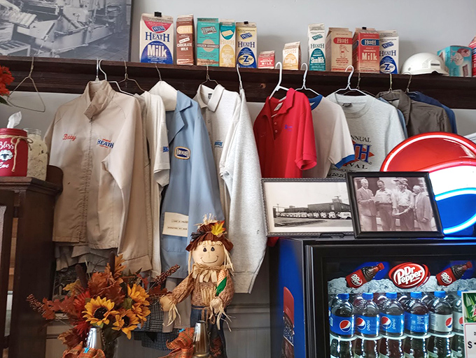 Not just candy makers but fashion icons! Original Heath employee uniforms hang preserved, complete with name tags from decades past.