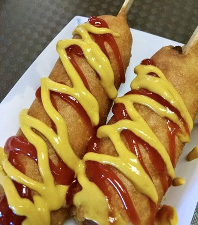 Zigzags of ketchup and mustard add vibrant color and tangy contrast to the sweet cornmeal batter of these legendary Route 66 treats.