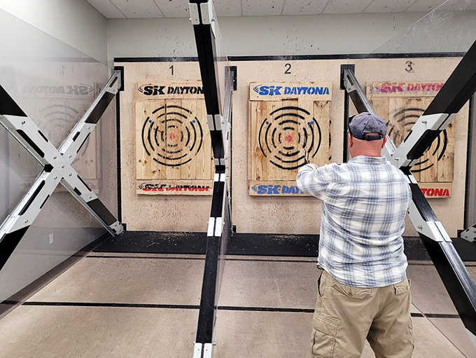 Between races, test your aim at the axe-throwing station – because nothing complements high-speed driving like hurling sharp objects at wooden targets.