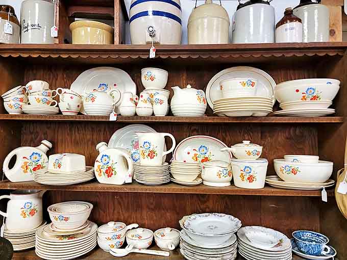 Grandmother's china cabinet comes to life with complete sets of floral-patterned dinnerware, each piece telling stories of family gatherings past.