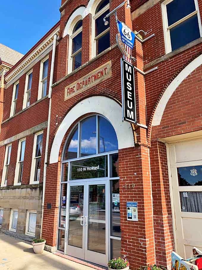The museum entrance beckons with its arched doorway and Route 66 signage, promising adventures in Americana just beyond the threshold.