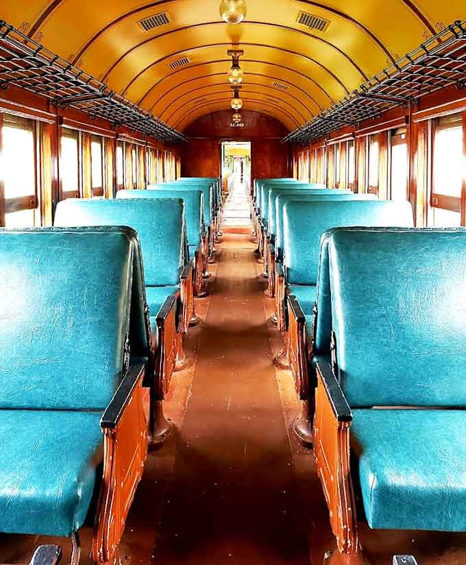 Step inside a time capsule of travel elegance – turquoise seats and warm wood paneling create an atmosphere modern airlines can only dream about.