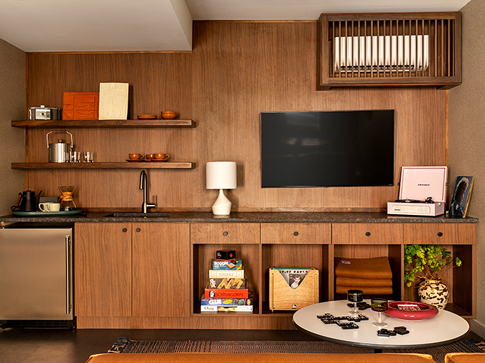 Relax in our stylish lounge featuring a kitchenette, record player, and classic games. It is your perfect home away from home!