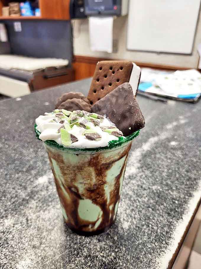 This isn't just a mint chocolate chip shake &ndash; it's a portable celebration with whipped cream, chocolate drizzle, and enough mint to make your dentist jealous.