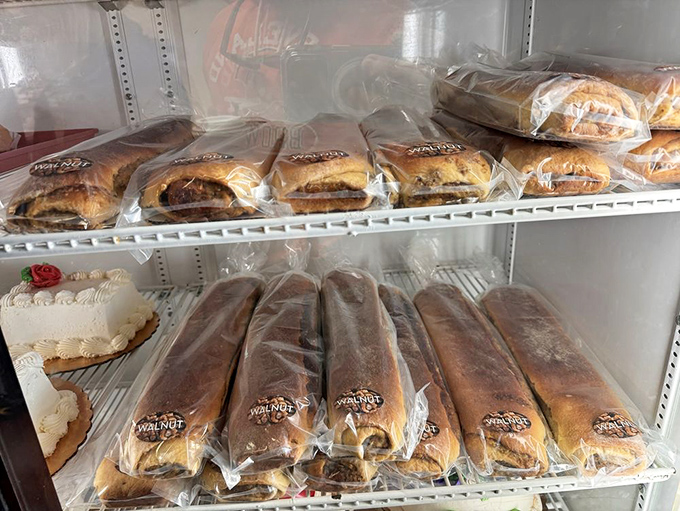 Perfectly packaged temptation &ndash; one box holds airy, sugar-dusted pastries while the other showcases an assortment of glazed and chocolate-dipped delights.