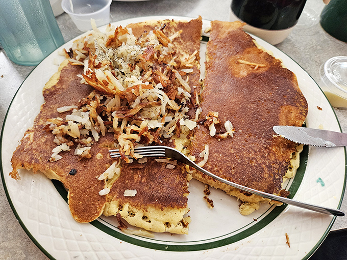 Breakfast innovation at its finest &ndash; a golden pancake crowned with perfectly crispy hash browns creates a textural masterpiece worth crossing state lines for.