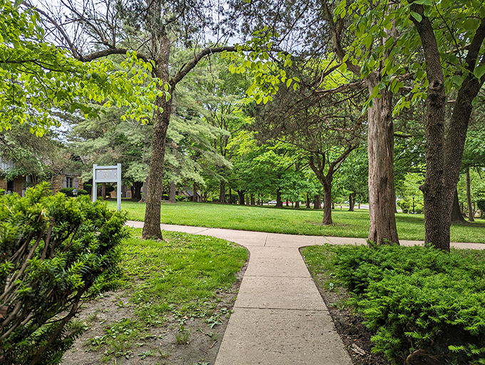 Gentle pathways wind through manicured grounds, perfect for those who prefer their nature experiences with a side of civilization.