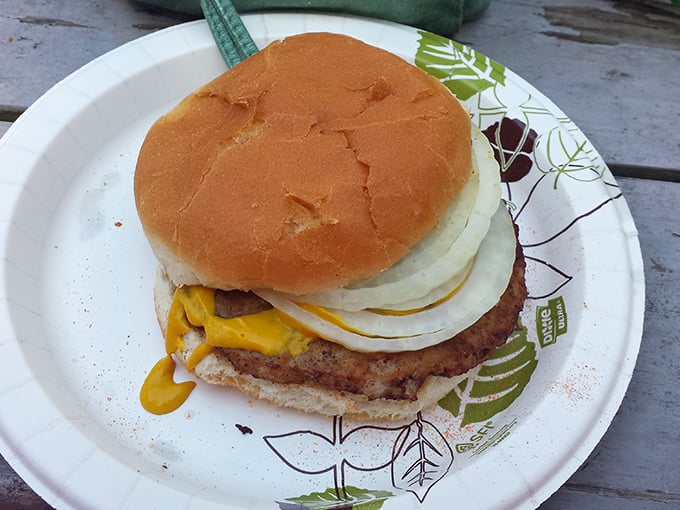 Each burger comes dressed with the classics &ndash; cheese melting into the hot patty with fresh onions and tomato for that timeless American flavor.