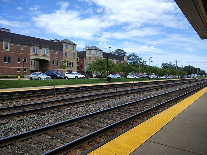 The Metra station serves as Downers Grove's connection to Chicago, where commuters gather daily before journeying to the big city.