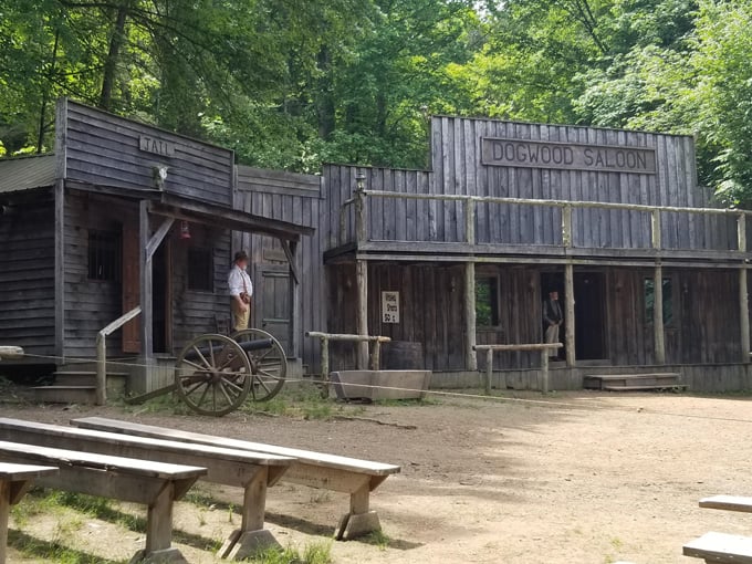 The Dogwood Saloon stands ready for thirsty travelers, its weathered facade promising cold drinks and lively company.