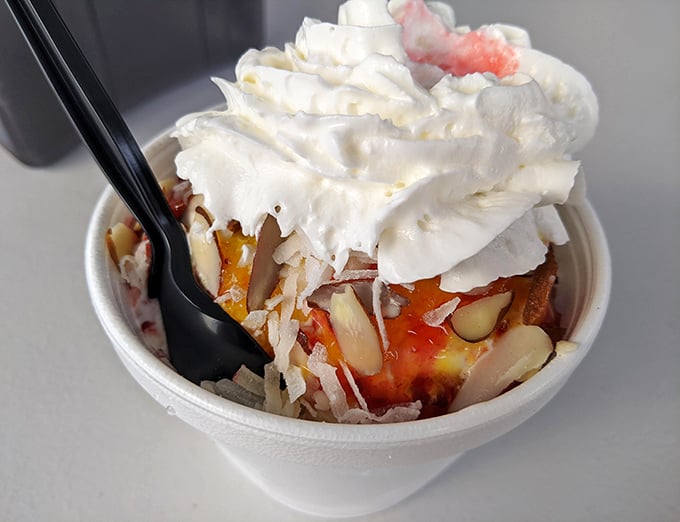 A tropical vacation in dessert form &ndash; creamy soft serve crowns a paradise of coconut, fruit, and nuts.