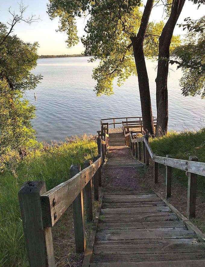 These rustic steps descend to a perfect lakeside perch &ndash; nature's front-row seats to Minnesota's most peaceful show.
