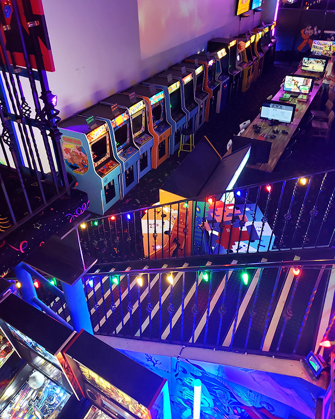 A gaming kingdom spread before you&mdash;rows of cabinets waiting for their next challenger while colorful railings guide you through this electronic playground.