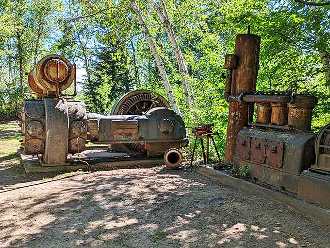 Rusted giants rest in forest clearings, their mechanical muscles long retired from the backbreaking work of hauling copper ore.