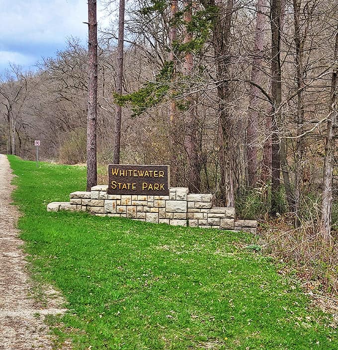 The welcoming sign to Whitewater State Park &ndash; where cell service fades but life's reception gets crystal clear.