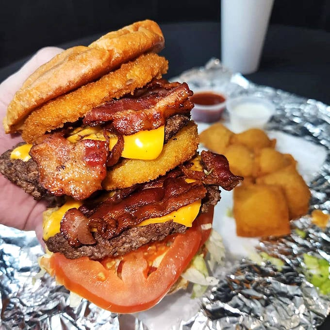 This isn't just a burger &ndash; it's a towering monument to excess, where bacon, cheese, and beef create a skyscraper of flavor worth every napkin.
