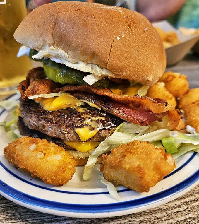 Behold the bacon cheeseburger in its natural habitat &ndash; a monument to excess that somehow maintains perfect structural integrity until the final bite.